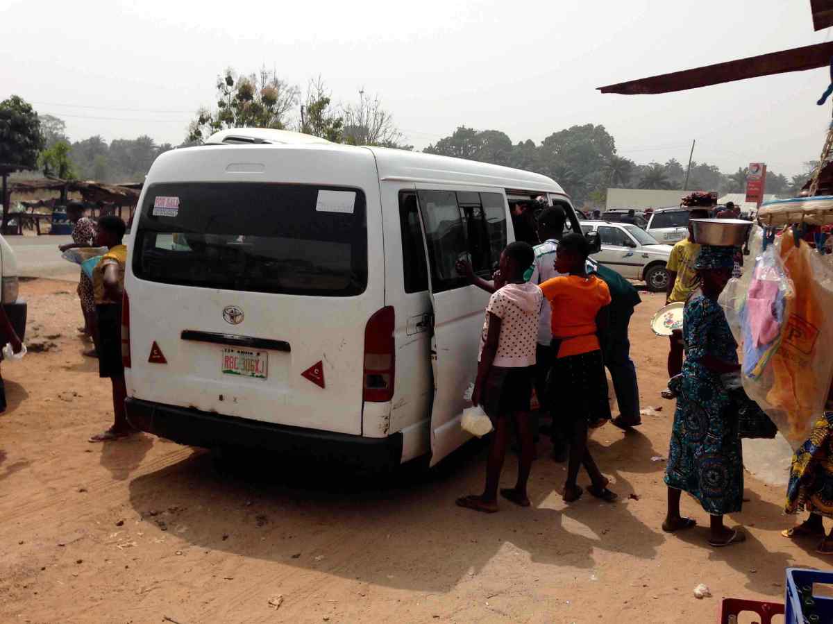 Women and young girls roadside hawking food in Ibillo, Edo, Nigeria. # ...